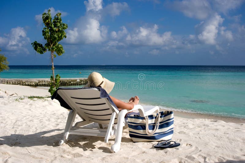 Women Sitting on the Sun Lounger on the Beach Stock Image - Image of ...