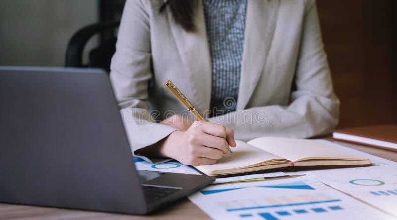 Women Sitting at a Table at Home Working on a Laptop Computer and ...