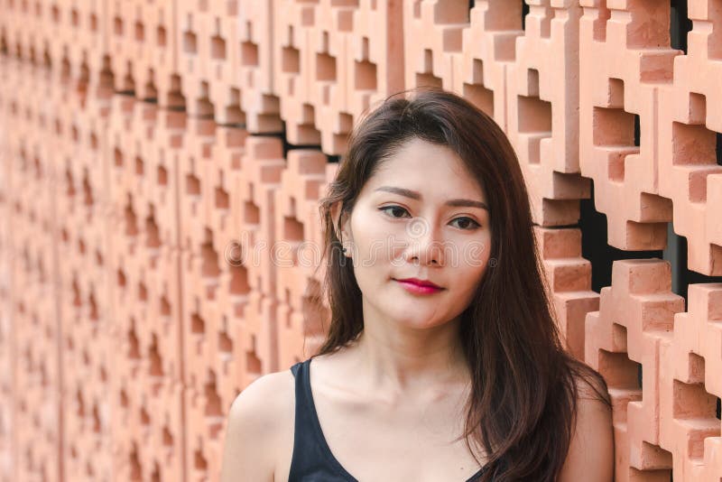 Women are Standing Against Old Brick Walls Stock Image - Image of ...