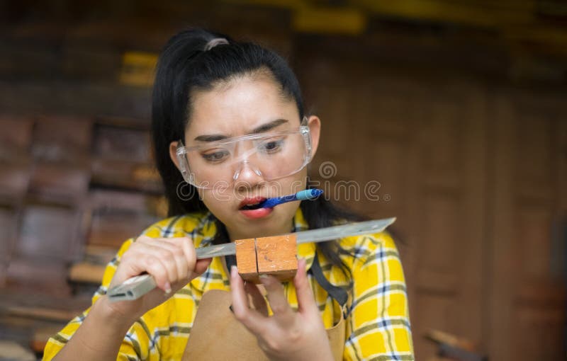 Women Standing is Craft Working Cut Wood at a Work Bench with Band Saws ...