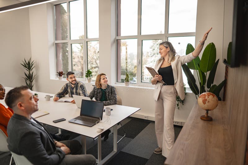 Woman Giving Presentation To Group of People Stock Image - Image of ...