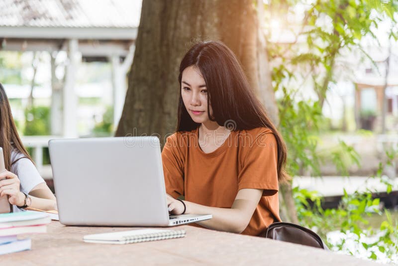 Women Students are Using Computer Laptop Outdoor Stock Image - Image of ...
