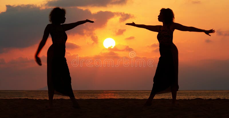 Women at sunset stock photo. Image of dancing, beach, dramatic - 1628920