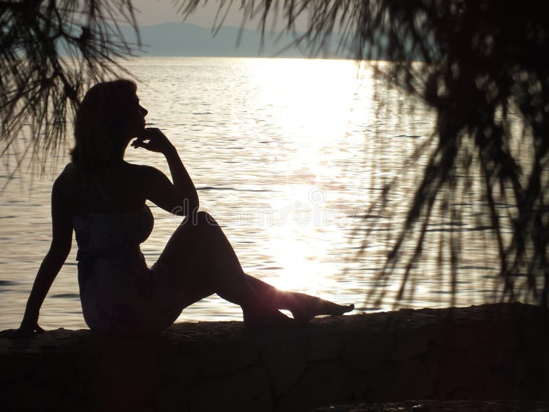 Women in the sunset stock photo. Image of horizon, peace - 26689864