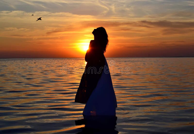Women at sunset. stock photo. Image of scene, lonely - 71080256