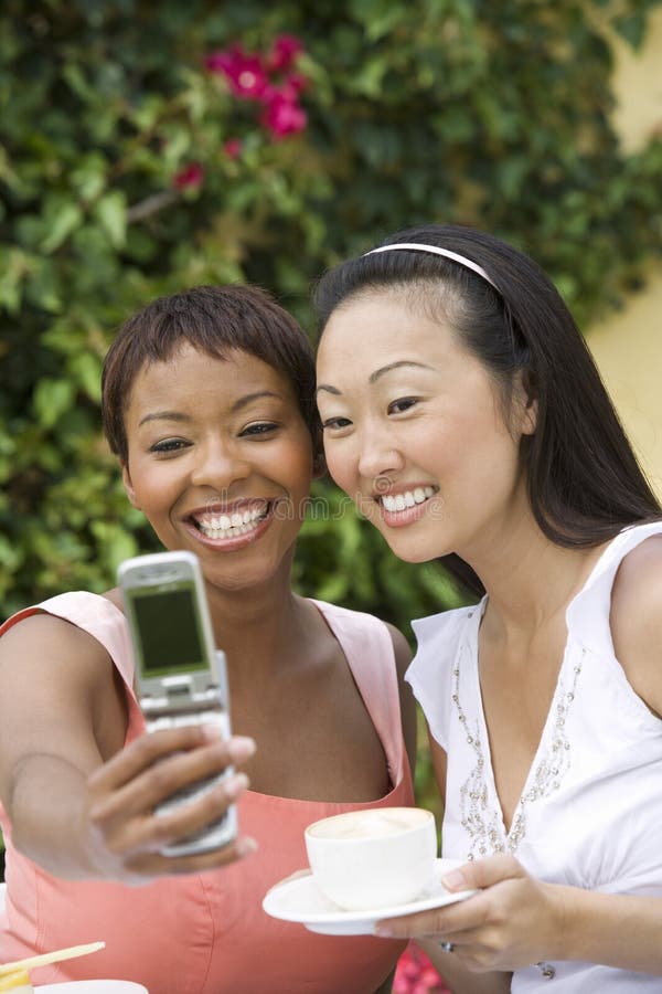 Women Taking Self-Portrait through Cell Phone Stock Photo - Image of ...