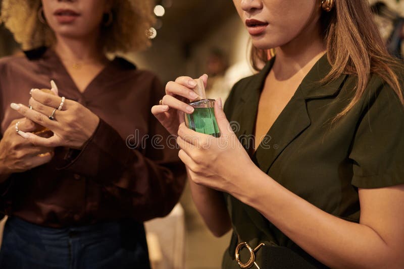 Women Testing New Perfumes stock image. Image of fashion - 262771687
