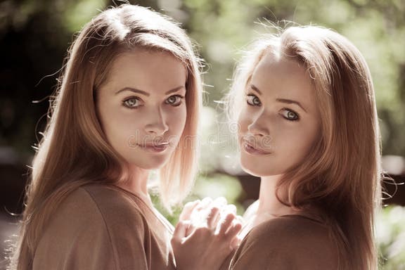 Women, twins in the forest stock photo. Image of forest - 21940634