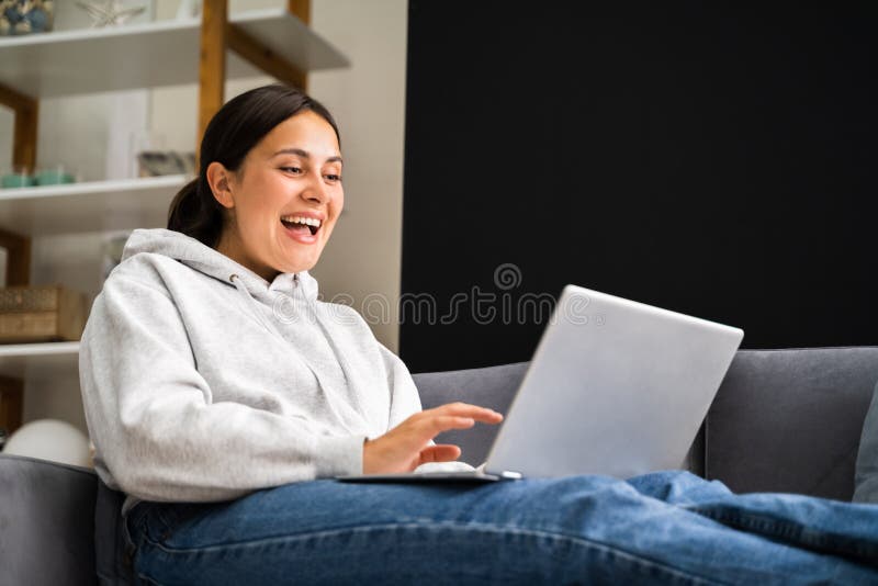 Women Using Computer Laptop on Couch Stock Photo - Image of caucasian ...