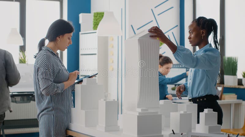 Women Using Digital Tablet To Design Building Model for Urban ...