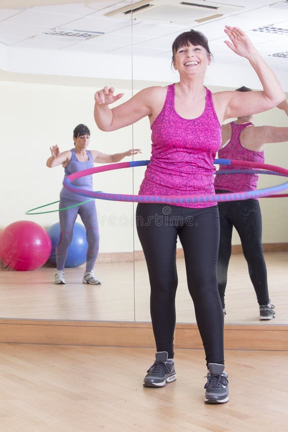 Women Using Hoops at the Gym Stock Image - Image of laughing, hobby ...