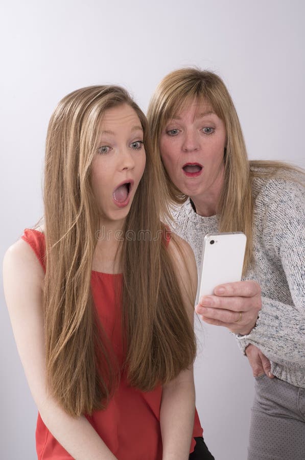 Women using a mobile phone stock photo. Image of looking - 68382644