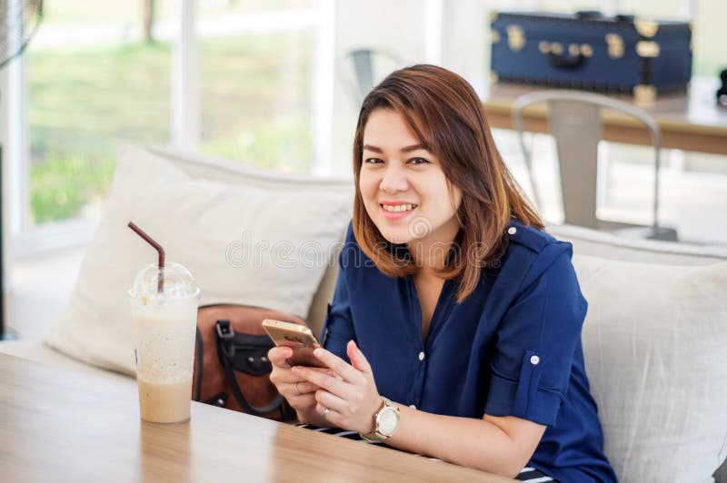 Women using a smartphone stock photo. Image of messaging - 71031636