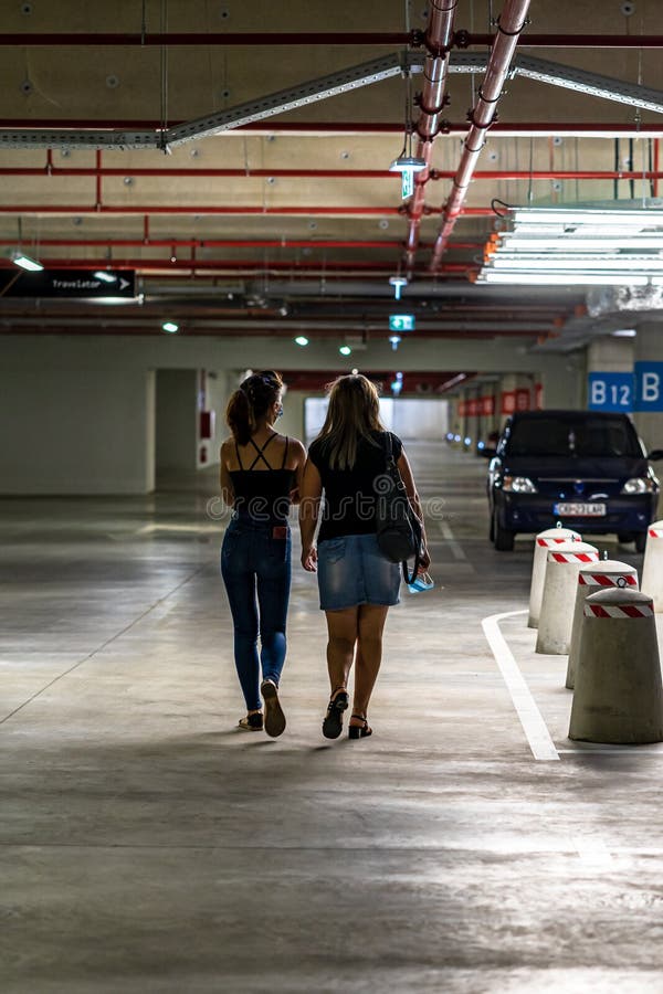 Women Walking Alone in Underground Parking Garage in Bucharest, Romania ...