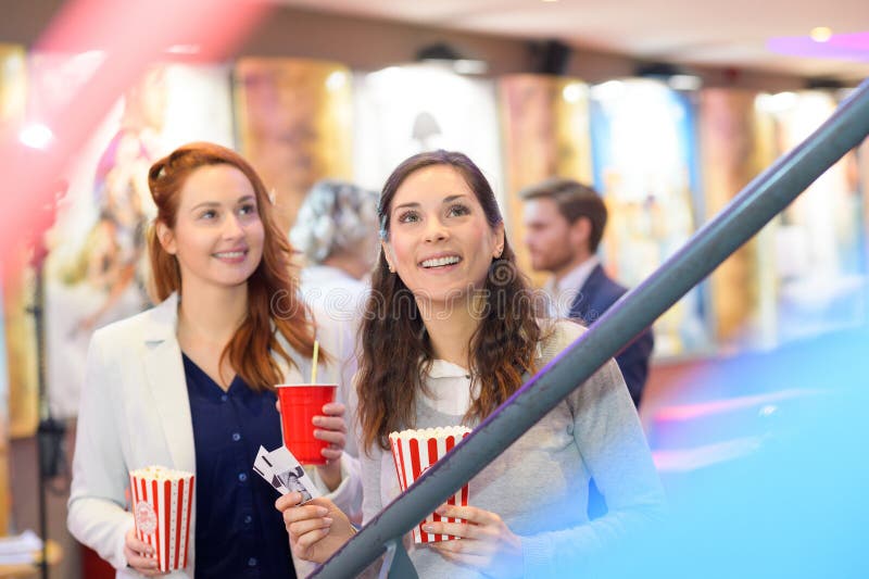 Women Walking on Cinema Lobby Stock Photo - Image of festival ...
