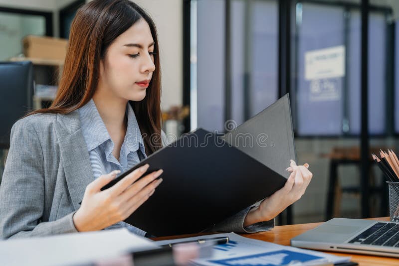 Women Work on Laptop on the Table at the Office with Information ...