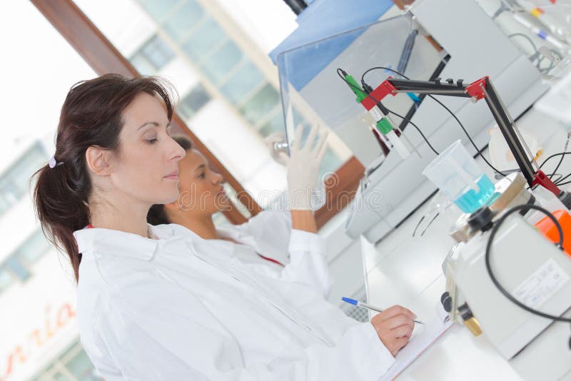 Women working in lab stock photo. Image of chemistry - 162597986