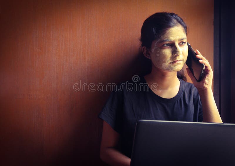 Women Working on Laptop Work from Home , Applying Face Pack Stock Photo ...