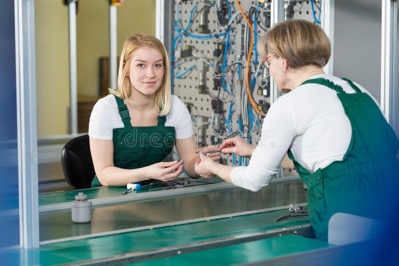 Female Assembly Line Workers Stock Photo - Image of female, indoor ...