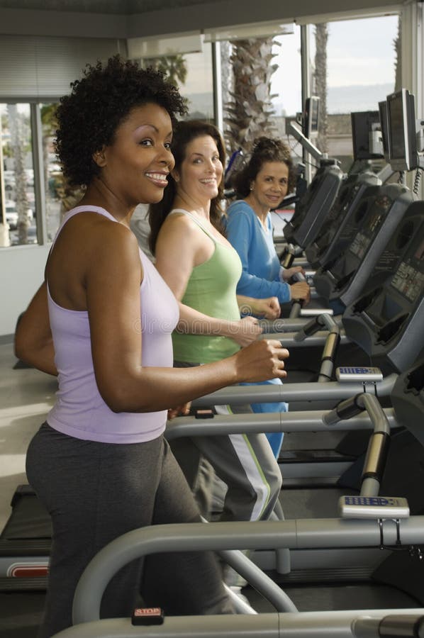 Friends on treadmills stock photo. Image of african, diverse - 9232392