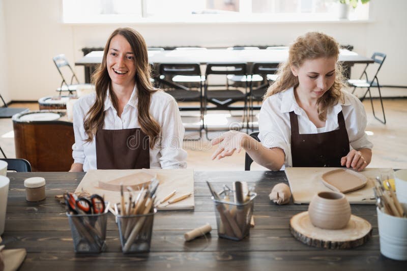 Women Working in Pottery Studio, Smiling and Talking. Ceramic Workshop ...