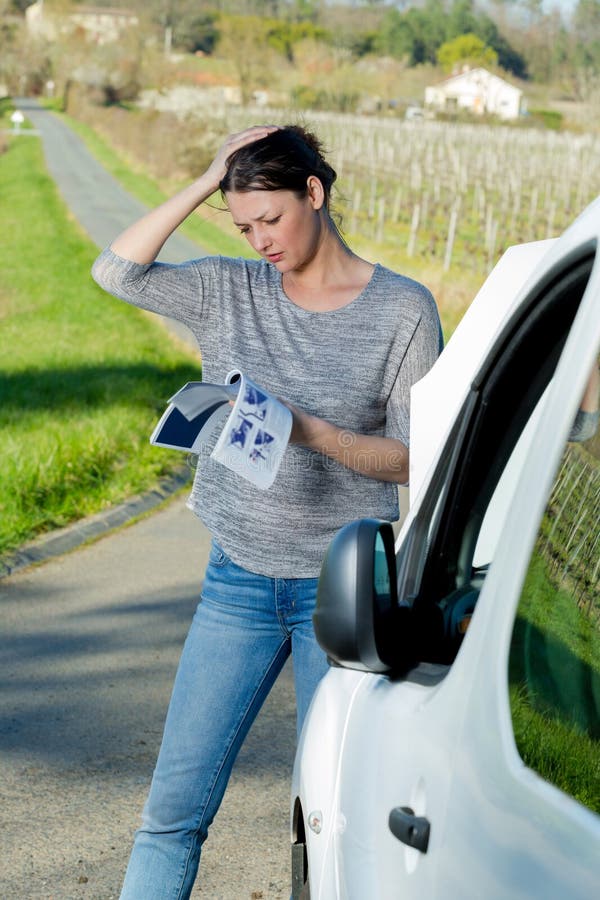 Womn with Broken Down Car Reading Instruction Manual Stock Image - Image of fail, insurance ...