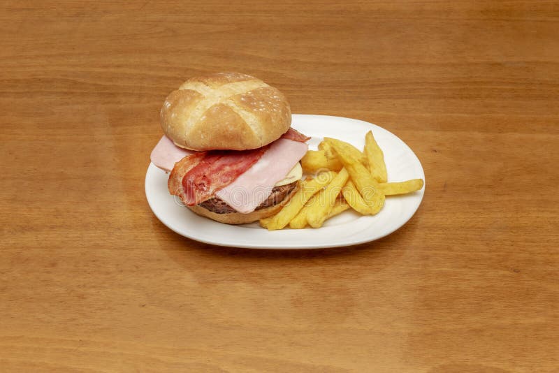 A Wonderful Beef Burger with a Slice of Fried Bacon, Sliced Cheese ...