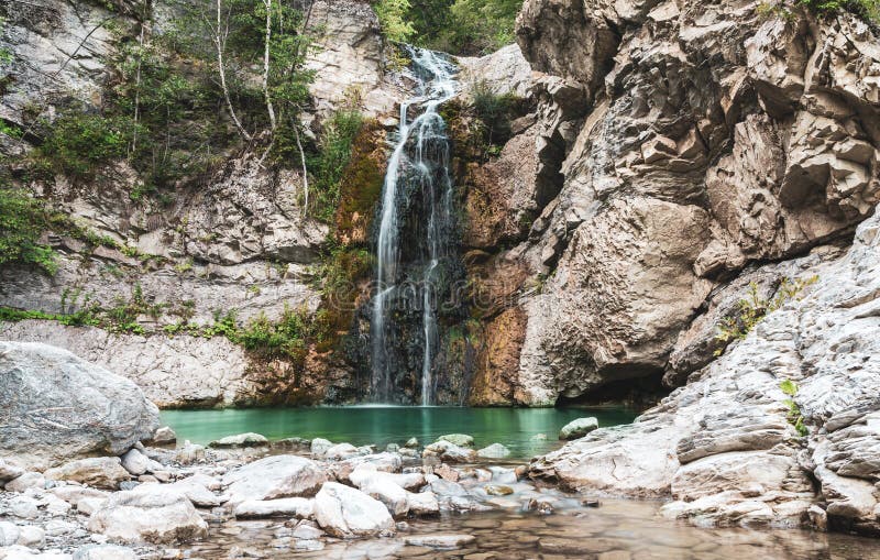 Wonderful Small Waterfall that Forms a Pond of Emerald Water in a ...