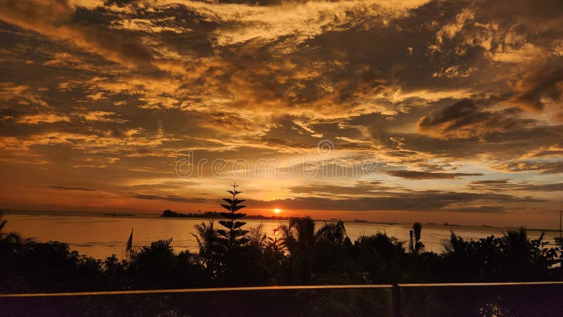 Wonderful sunset in Palu stock photo. Image of sulawesi - 261833342