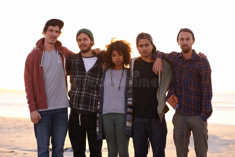 We Wont Back Down. a Group of Friends Walking Along a Beach at Sunset ...