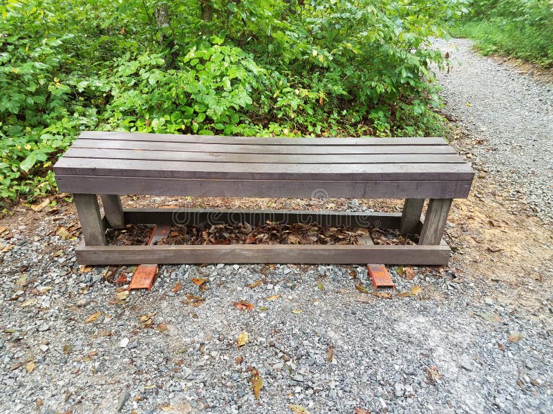 Wood bench on the ground stock photo. Image of bench - 97772530