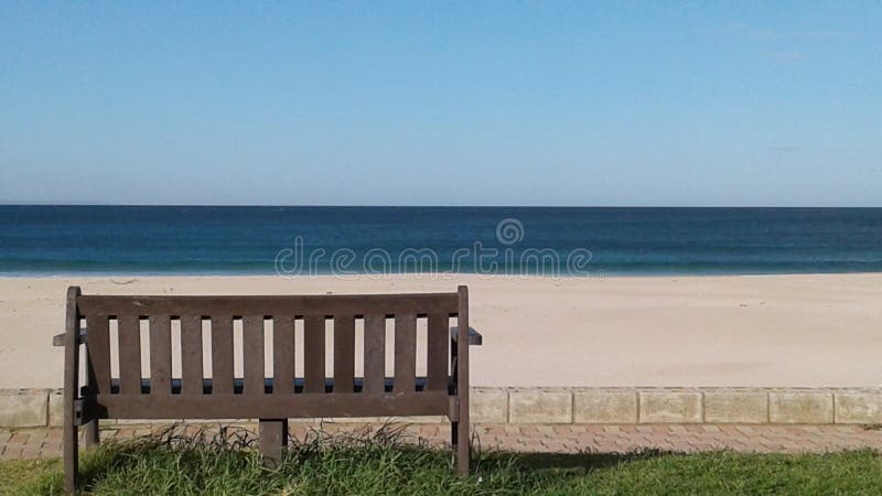 Wood bench on beach stock photo. Image of relax, infront - 188537164