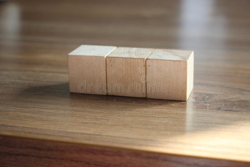 3 Wood Blocks Front View, on Wooden Table, Polished Wooden Table ...