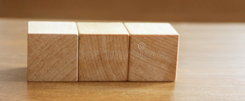 3 Wood Blocks Front View, on Wooden Table, Polished Wooden Table ...