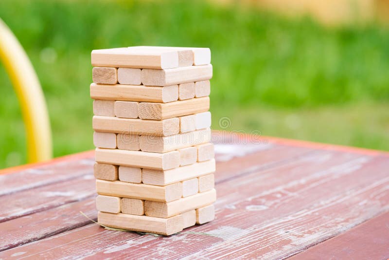 Wood Blocks Stack Game on the Park Table. Concept of Education, Risk ...