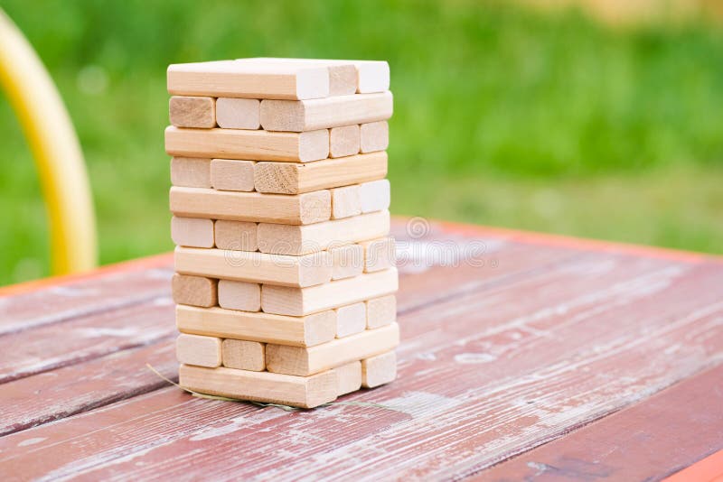 Wood Blocks Stack Game on the Park Table. Concept of Education, Risk ...