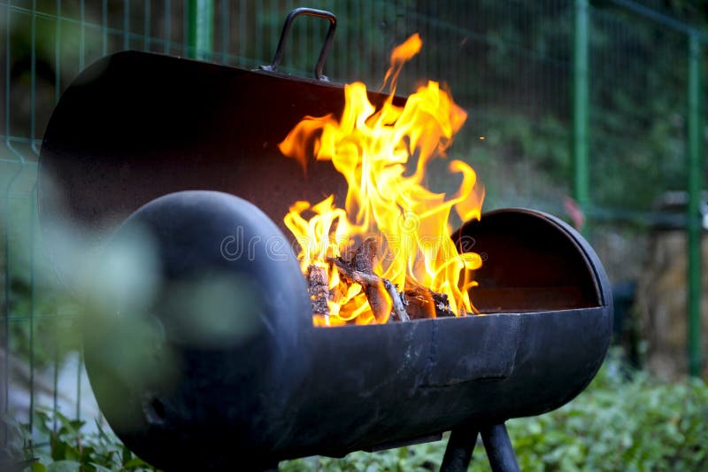 Wood Burning Barbecue in Backyard Stock Image - Image of yard, barbecue ...