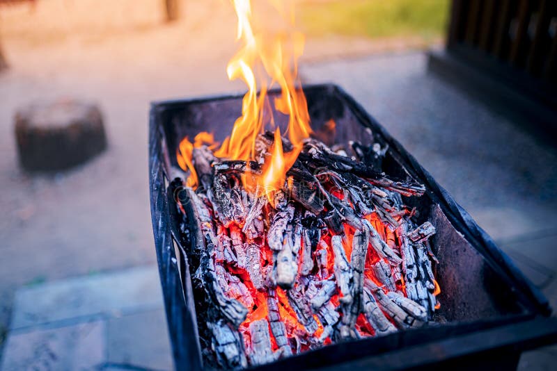 Wood burning in the grill stock photo. Image of glow - 152057456