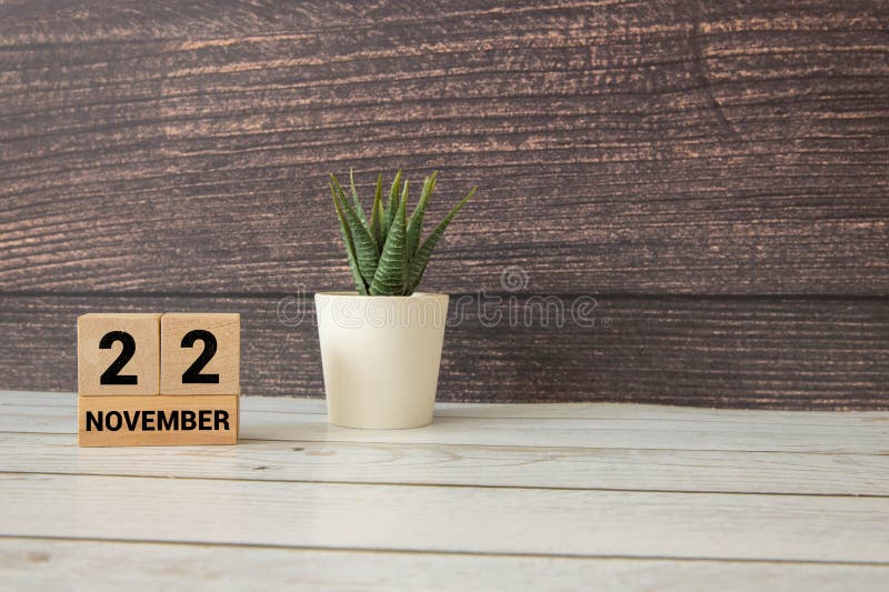 Wood Calendar with Date and Old Clock. Thursday 22 November Stock Photo ...