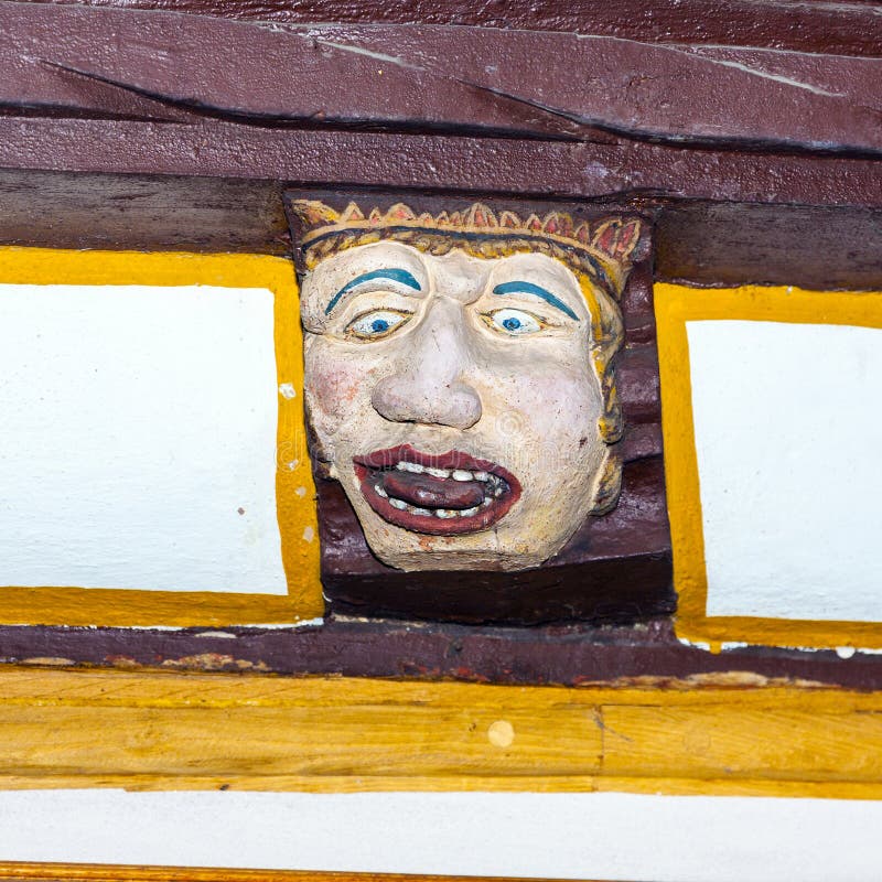 Wood Carving with Funny Face on Timber Balk Stock Photo - Image of ...