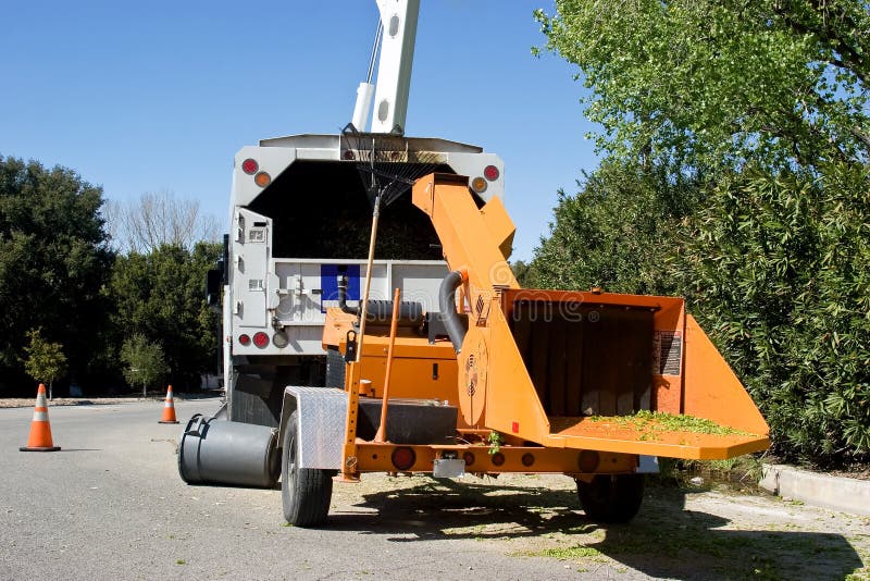 Wood chipper in action stock photo. Image of spewing, machinery - 10458
