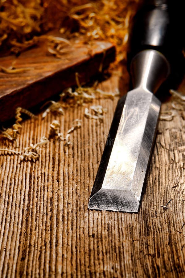 Wood Chisel on Distressed Old Wood Board Workbench Stock Image - Image ...