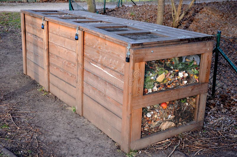 Wood Composter with Mesh on the Sides. Inside are Leftovers from the ...
