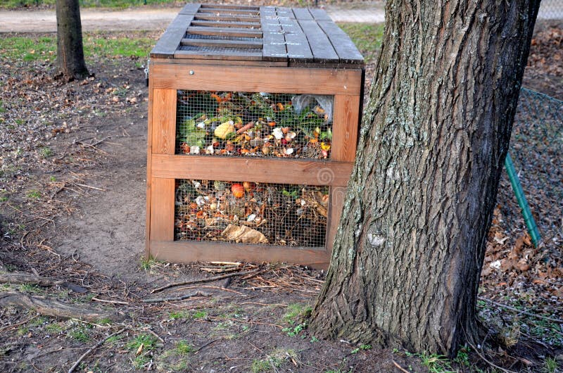 Wood Composter with Mesh on the Sides. Inside are Leftovers from the ...