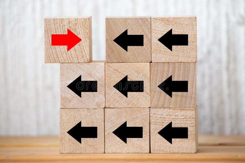 Wood Cube Presents Red Arrow Facing Opposite Direction, Concept of ...