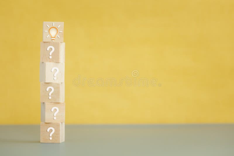 Wood Cube Stack with Question Mark and Light Bulb Icon Stock Photo ...