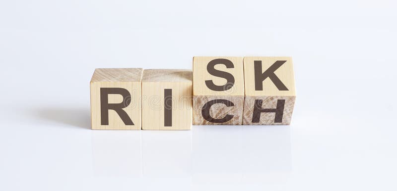 Risk Or Rich Concept, Hand Flip Wood Cube Change The Word Stock Photo ...