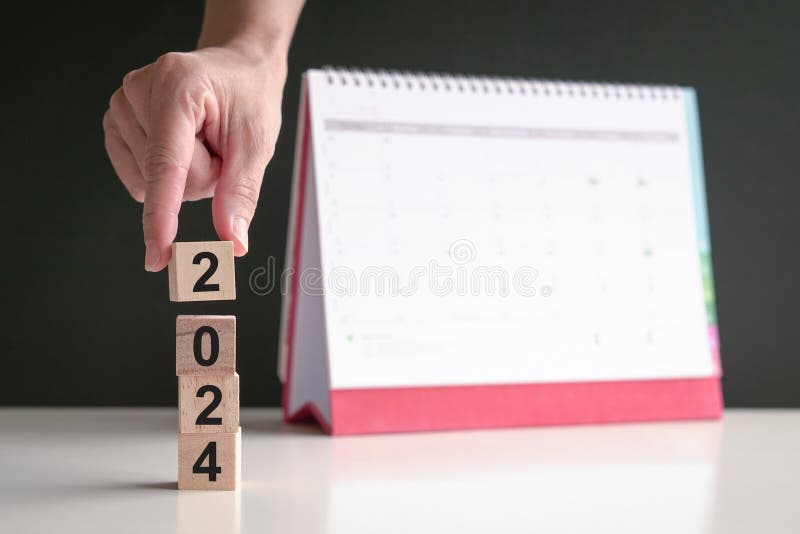 2024 Restart New Year Symbol. Businessman Turns a Wooden Cube and ...