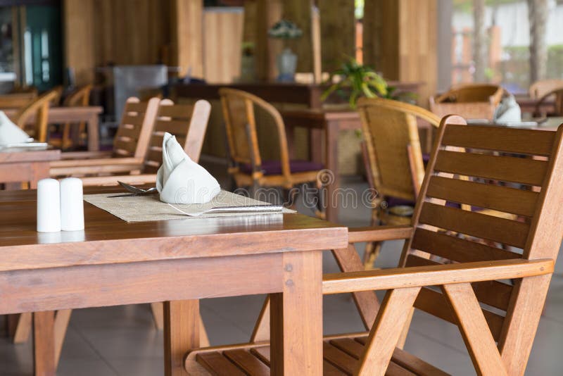 Wood dining tables stock photo. Image of elegant, cutlery - 66976620