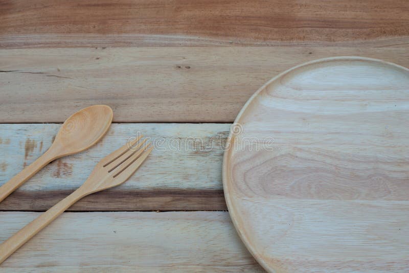 Wood Dish and Wood Fork on Wooden Table.with Text Space Stock Image ...